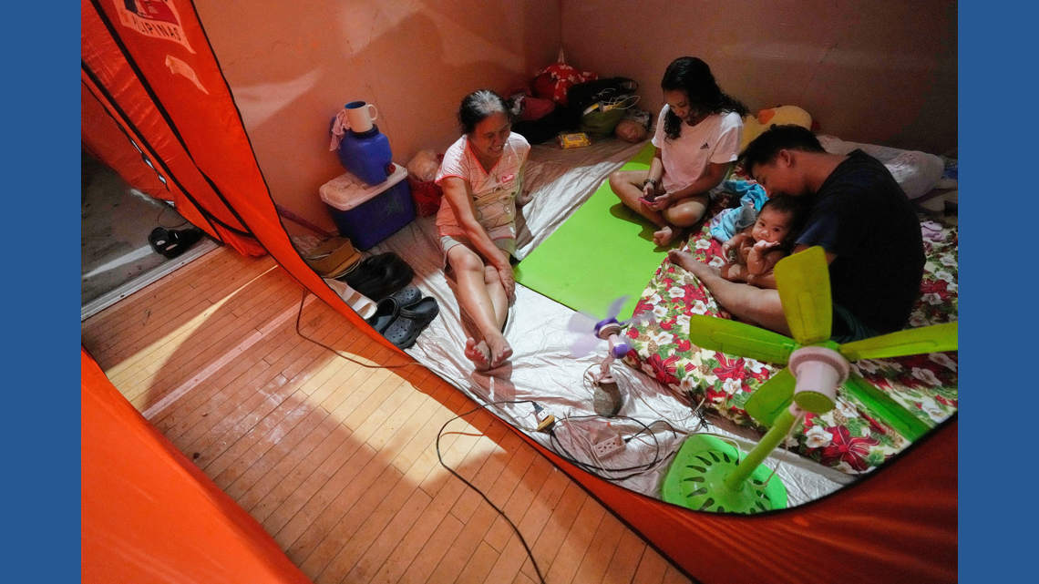 Typhoon Fung-wong blows away from the Philippines, leaving 2 dead and 1.4 million displaced ...