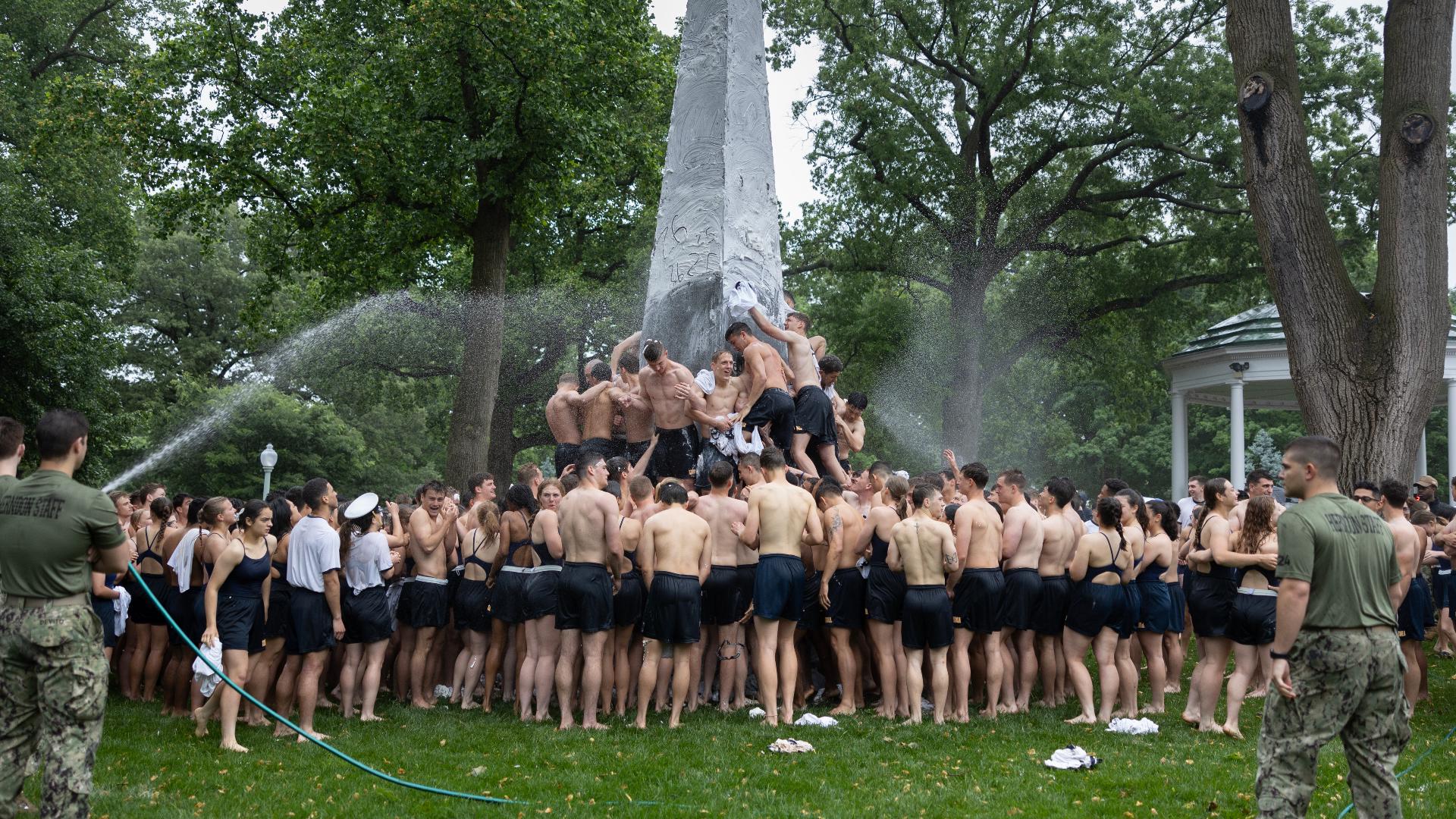 Naval Academy plebes climb greased monument in annual tradition ...