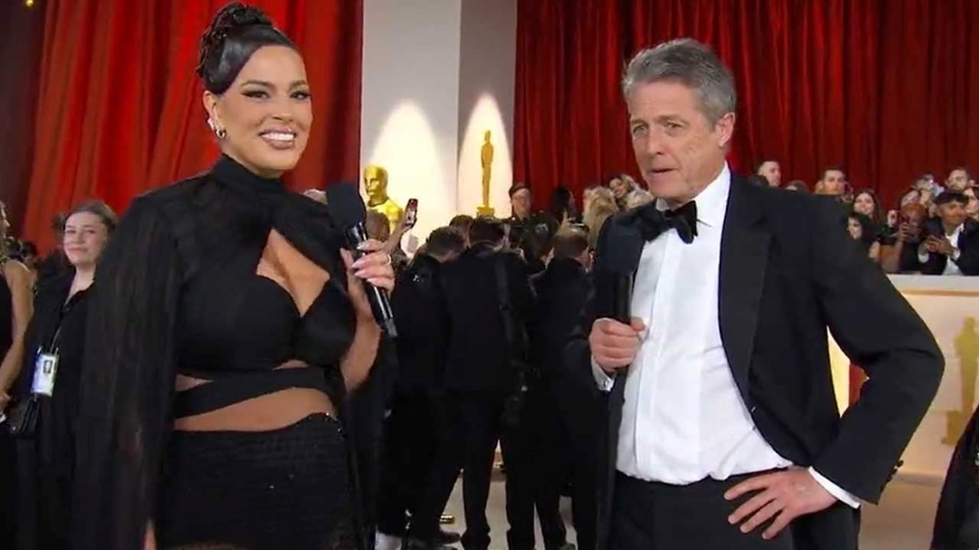 Hugh Grant Rolls His Eyes at Ashley Graham After Awkward 2023 Oscars Red Carpet Interview ...