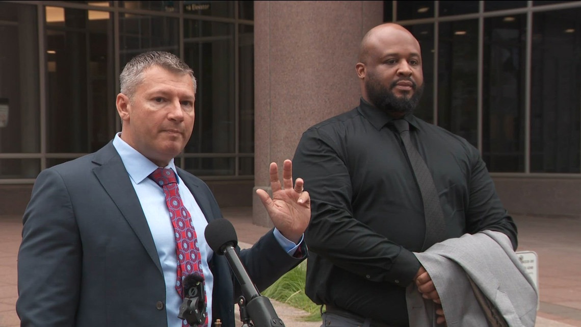 ICE agent accused of pointing his gun at commuters makes first court ...