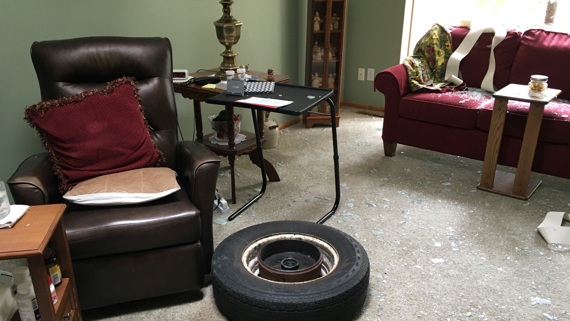 Close call in Coon Rapids after tire rips through window | kare11.com