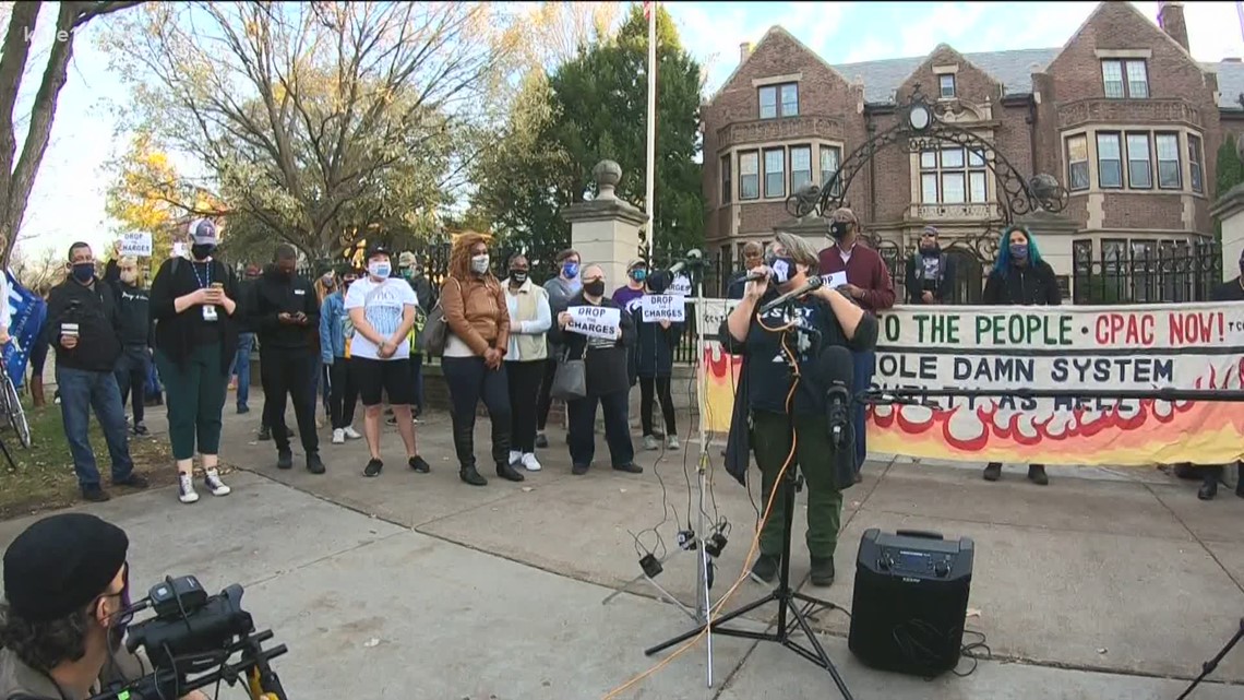 Organizers gather outside Gov. Walz's residence following Wednesday's ...