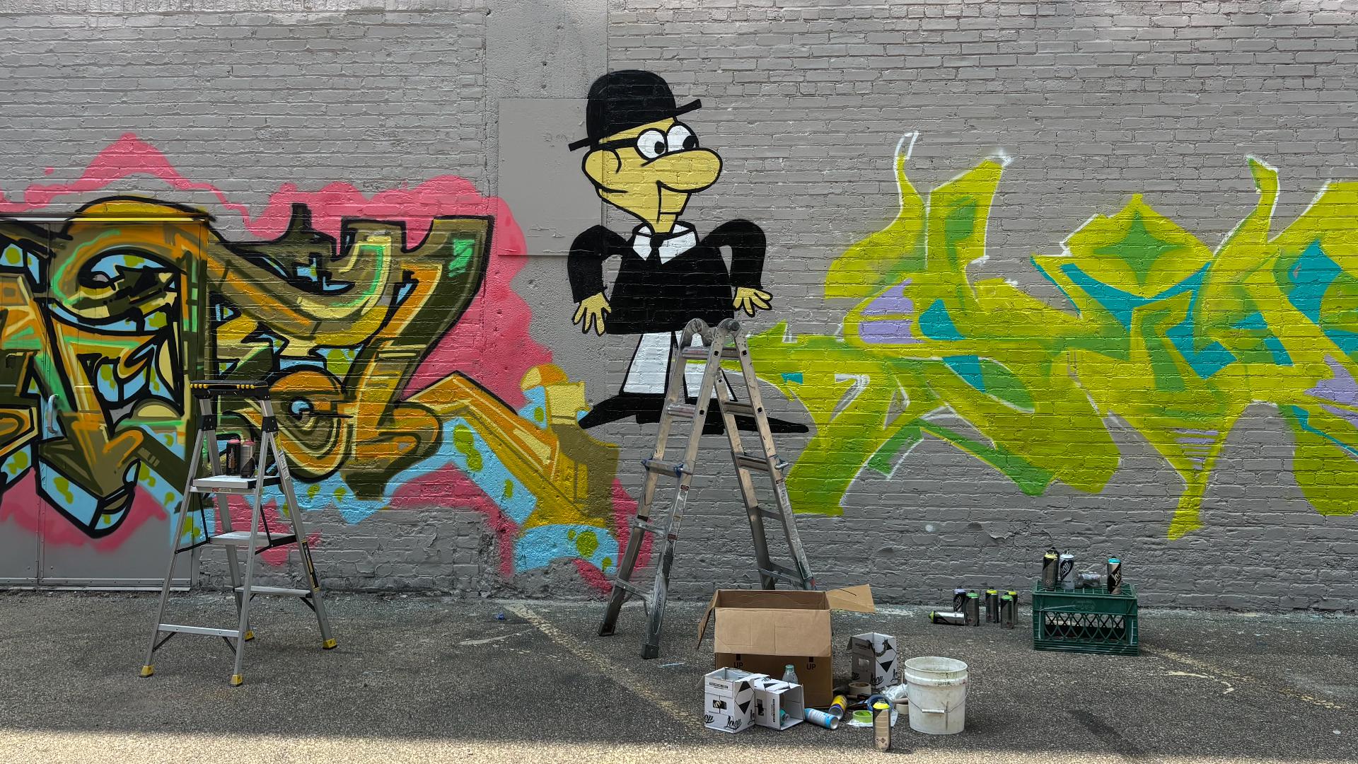 Street artists paint a mural in downtown Minneapolis alley | kare11.com