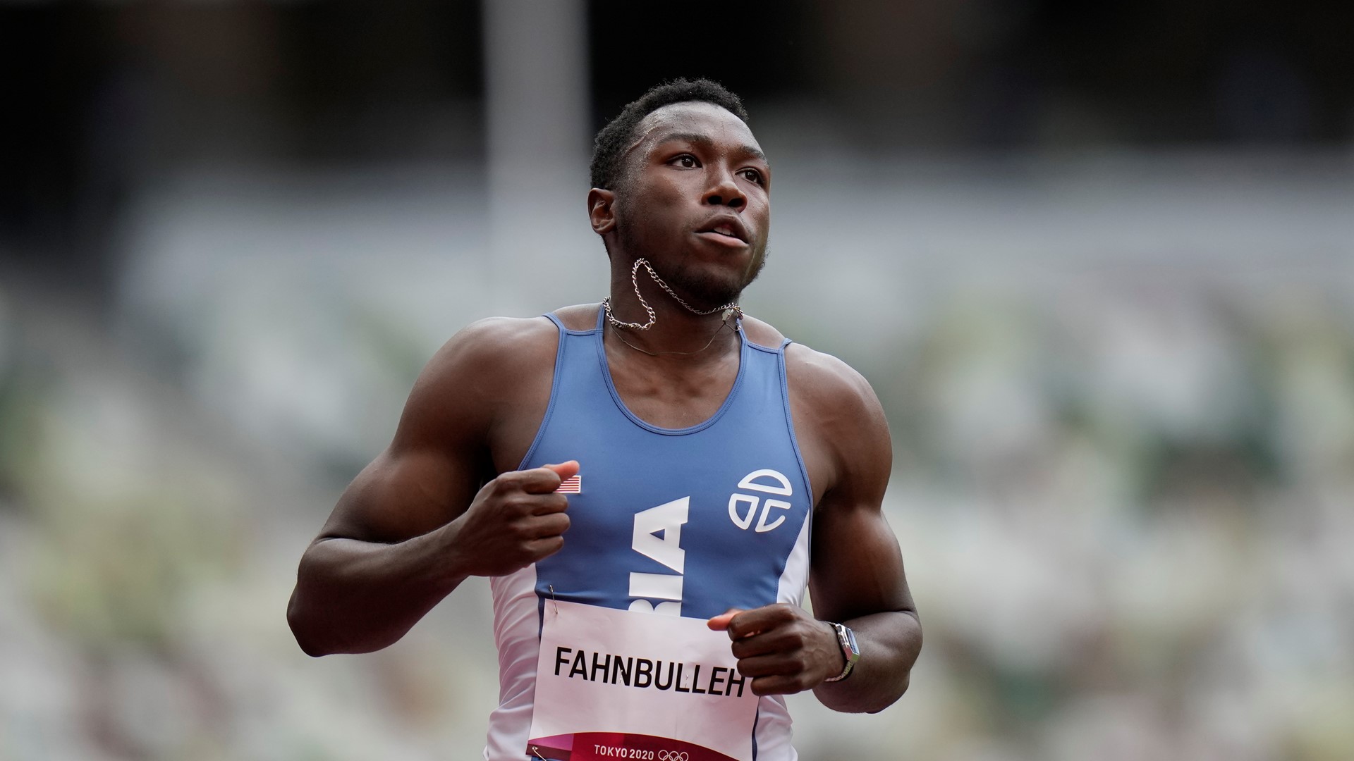Hopkins cheers for Liberia's Joe Fahnbulleh in 200-meter race | kare11.com