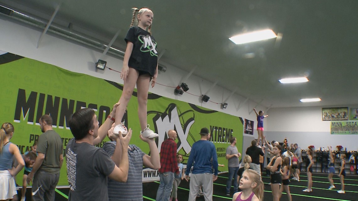 Daughters show dads the ropes in cheerleading | kare11.com
