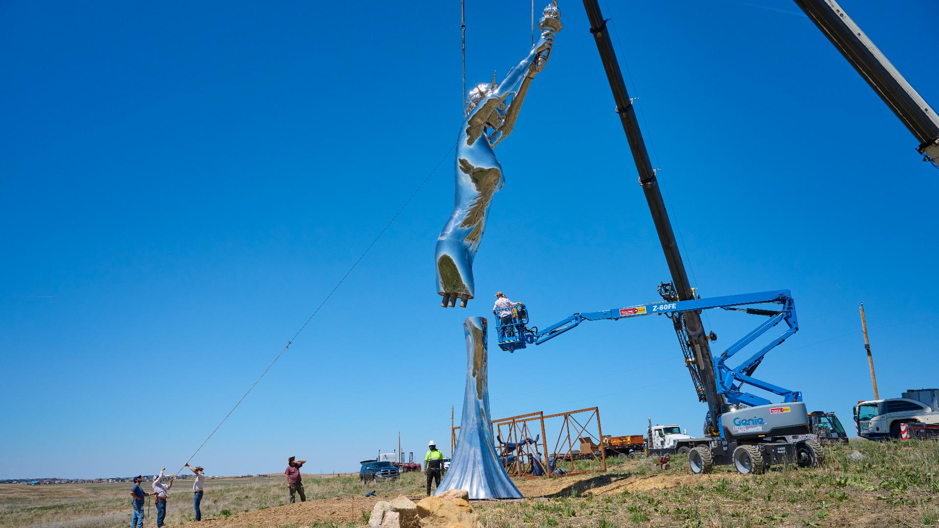 New 58-foot tall 'Liberty' art sculpture installed at The Aurora ...